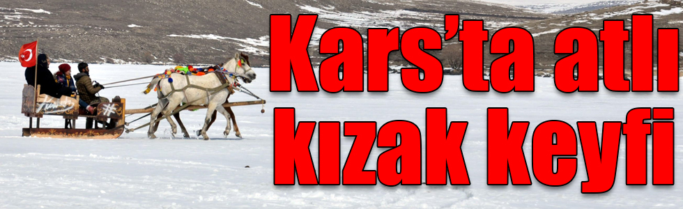 Kars’ta 40 santim buz tutan göl üzerinde atlı kızak keyfi